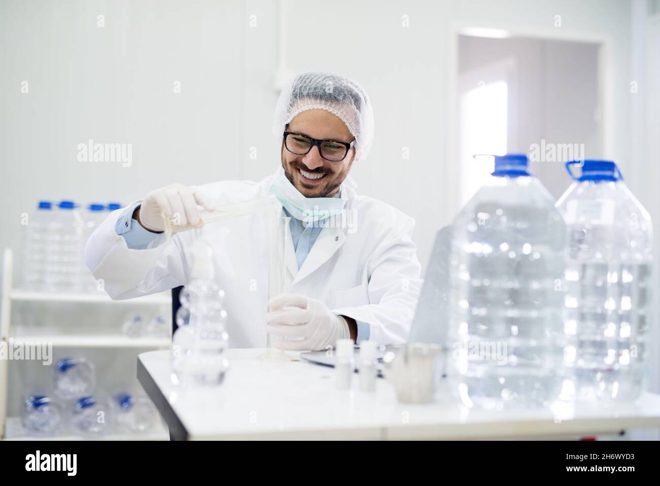 Lab technician doing chemical analysis. Testing chemical composition of ...