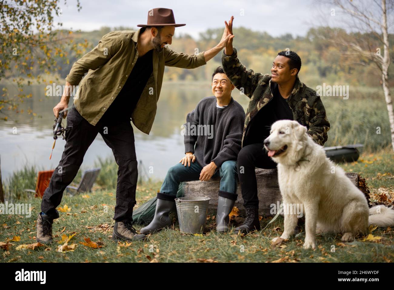Men give five each other and friend look this Stock Photo - Alamy