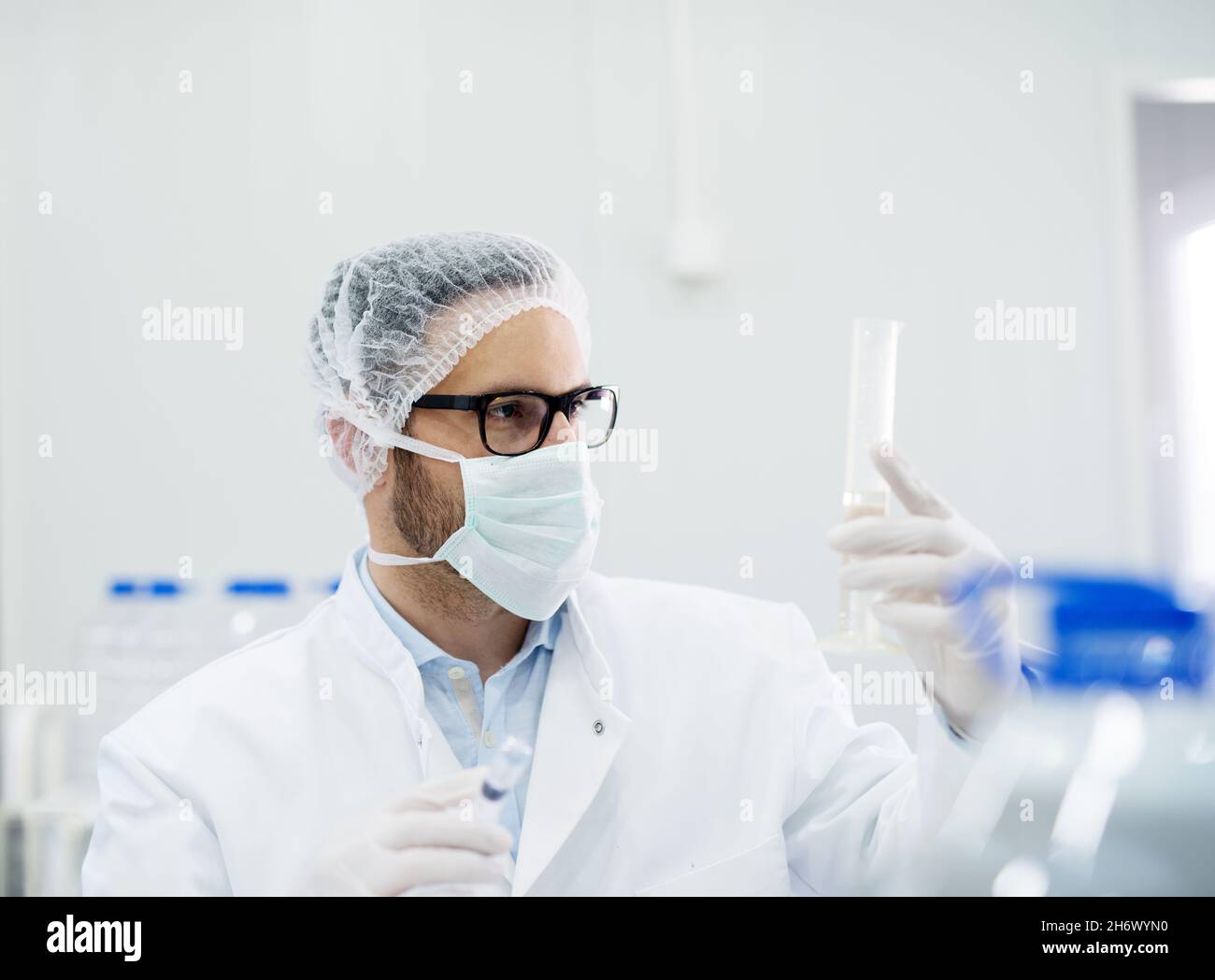 Lab technician doing chemical analysis. Testing chemical composition of ...