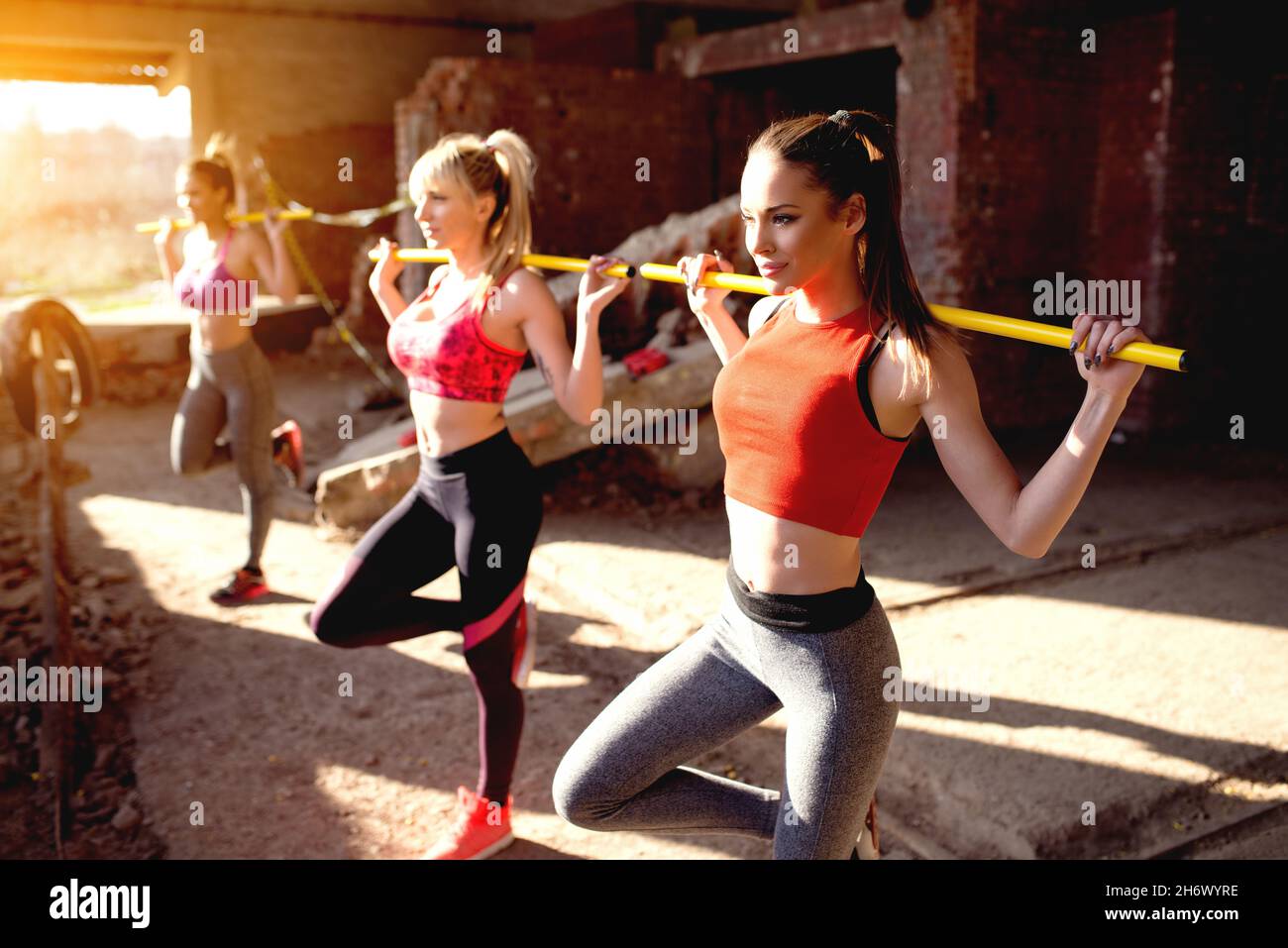 Attractive females having hard training outside the gym working out ...