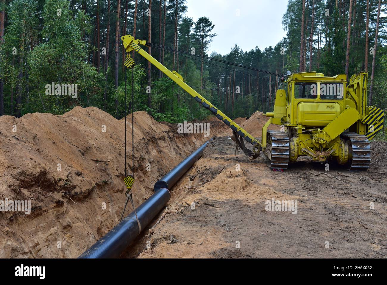 Installation Natural Gas pipeline in tranch. Crude oil pipes ...