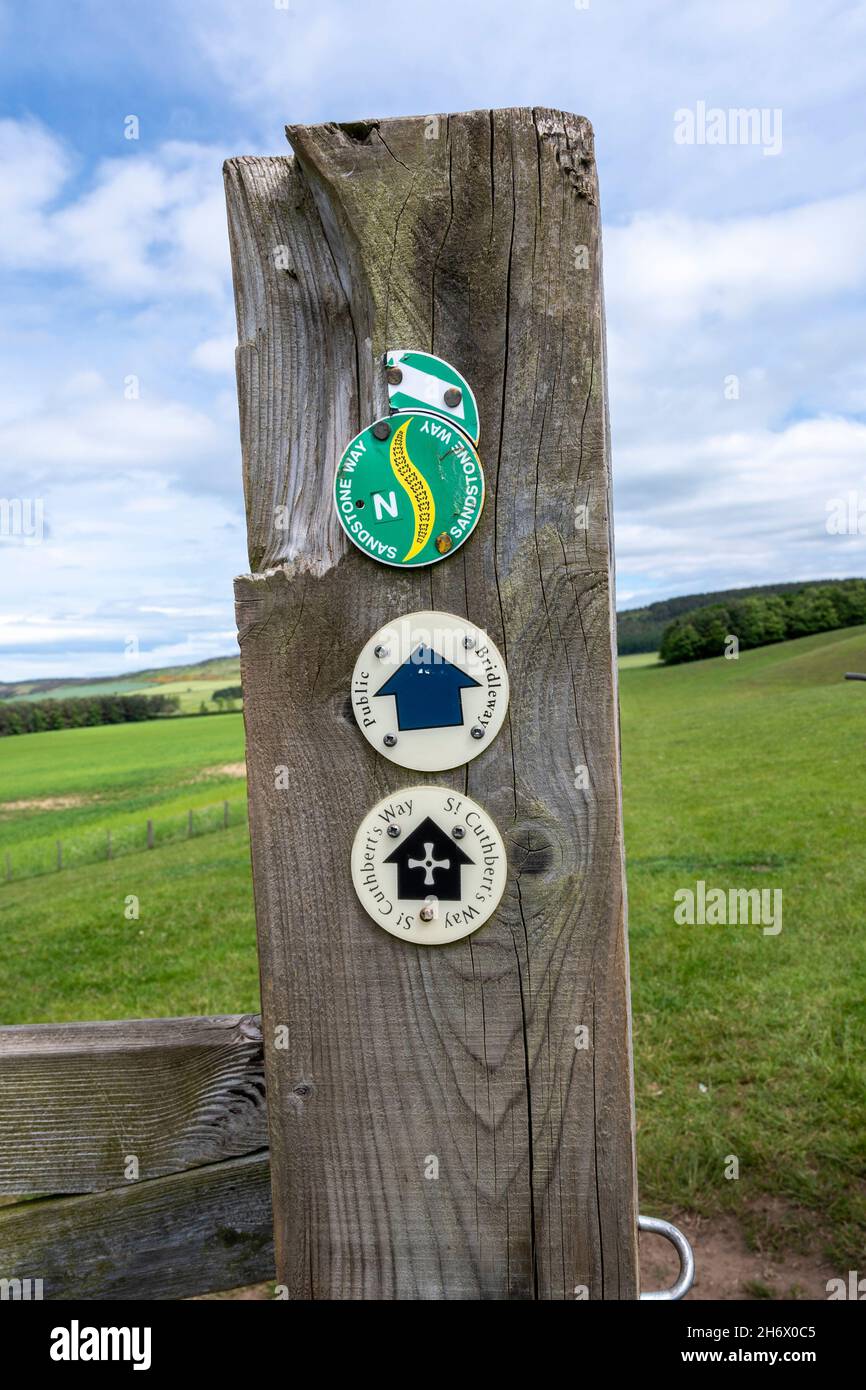 Way marks on a gate post for St Cuthbert's pilgrimage route, the ...