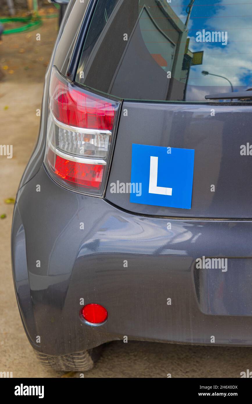 New Driver Blue L Plate Sticker at Small Car Stock Photo - Alamy