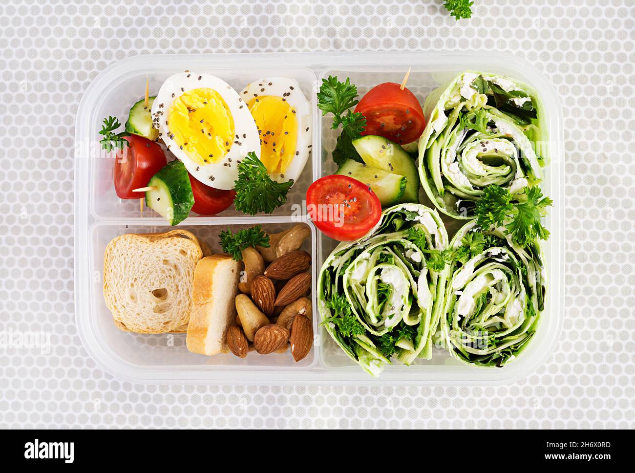 School lunchbox. Healthy lunch box with tortilla wraps with cream ...
