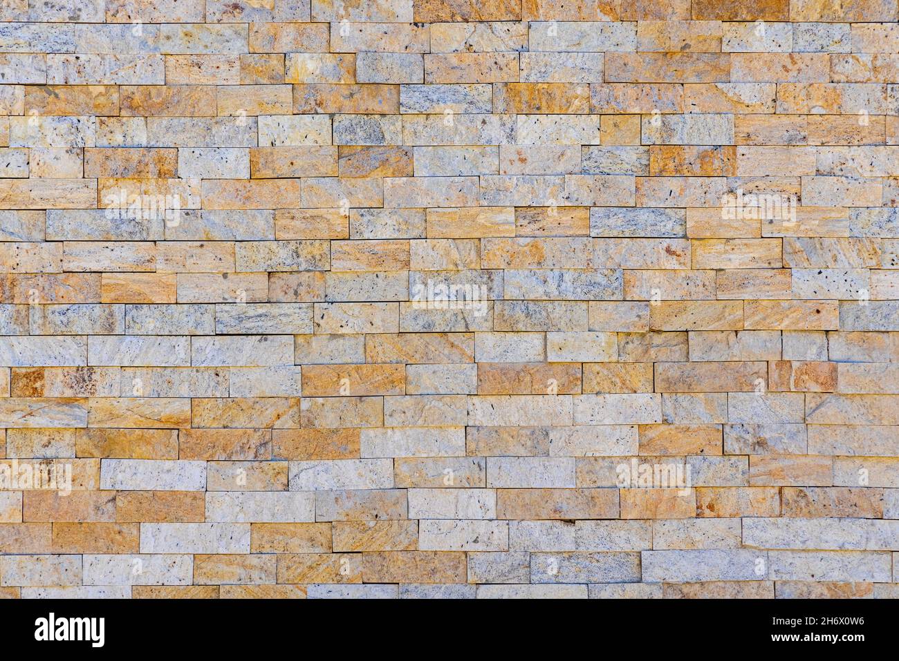 Yellow and White Natural Stone Tiles Wall Background Stock Photo - Alamy
