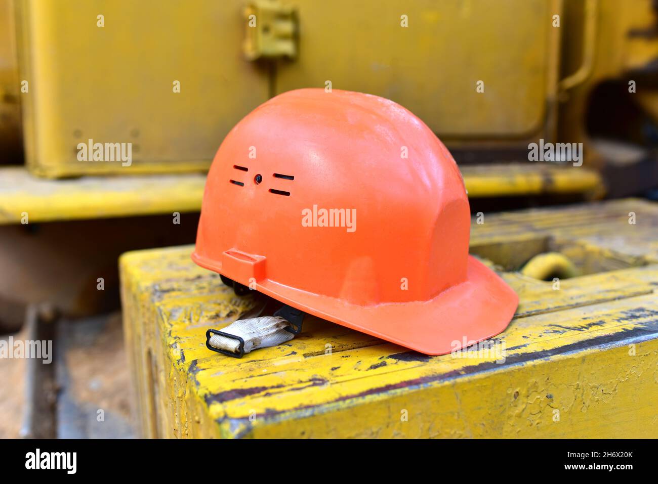 Red construction helmet. Headwear to protect the head of the worker ...