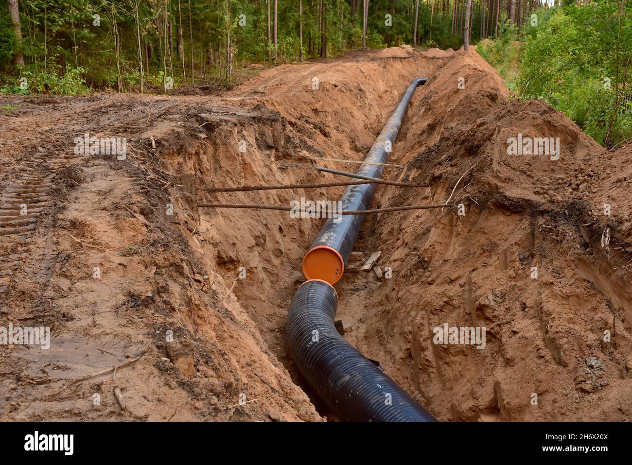 Crude oil and Natural gas pipeline construction work in forest area ...