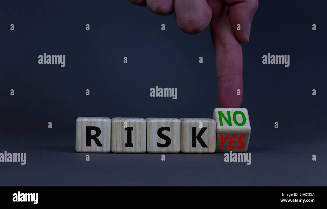Question about Risk symbol. Businessman turns a wooden cube and changes ...