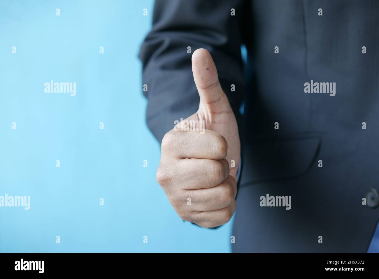 man hand showing a thumb-up Stock Photo - Alamy