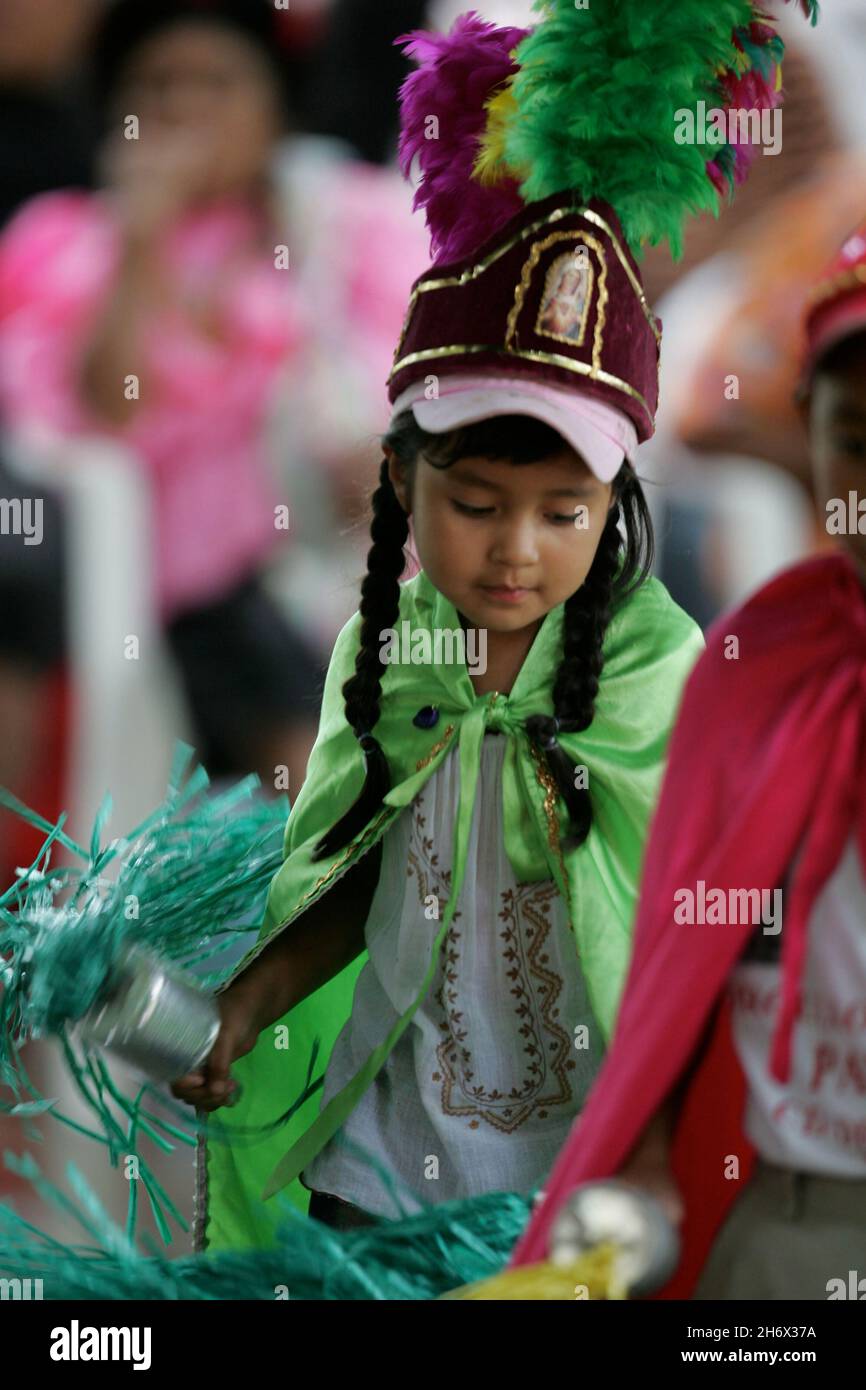 A child performing a typical dance from the Pame indigenous group ...