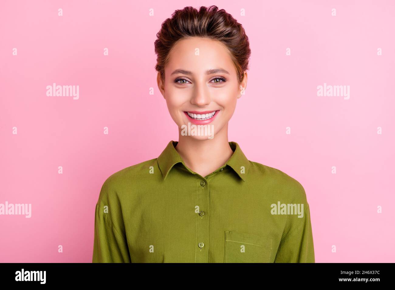 Photo of cheerful lovely lady shiny white smile posing wear green shirt isolated pink color ...