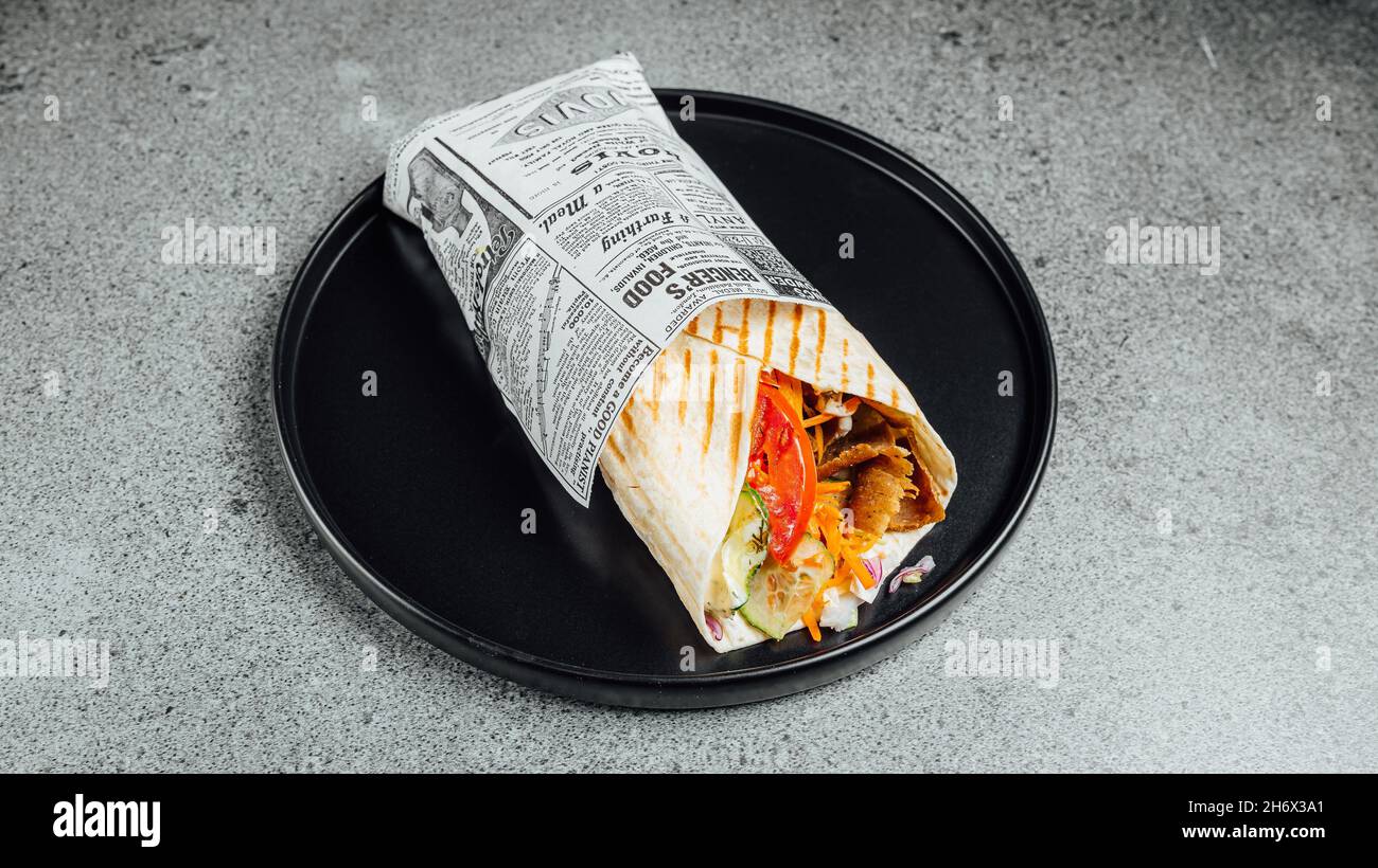 Closeup shot of tasty shawarma served on a black plate Stock Photo - Alamy