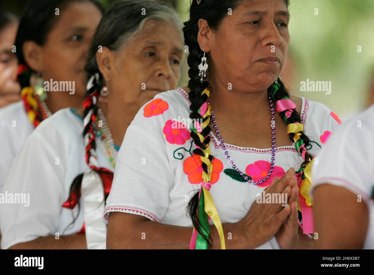 Woman from the Nahuatl indigenous group peforming a traditional dance ...