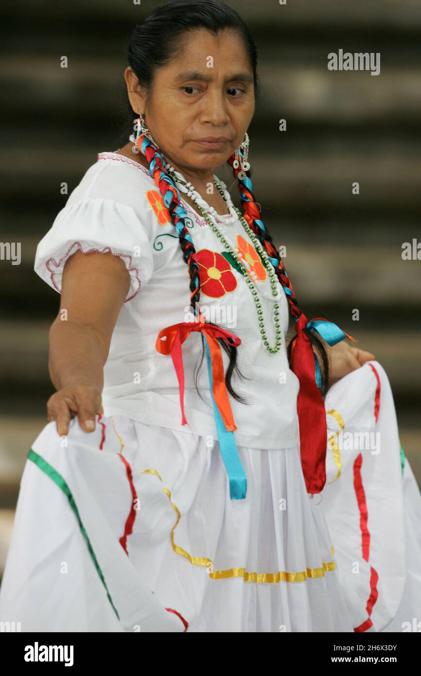 A woman from the Nahuatl indigenous group peforming a traditional dane ...