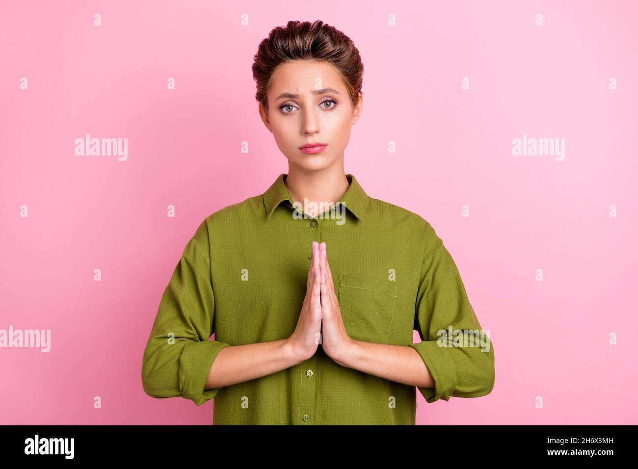 Photo of unhappy sad young lady wear green blouse arms together asking ...