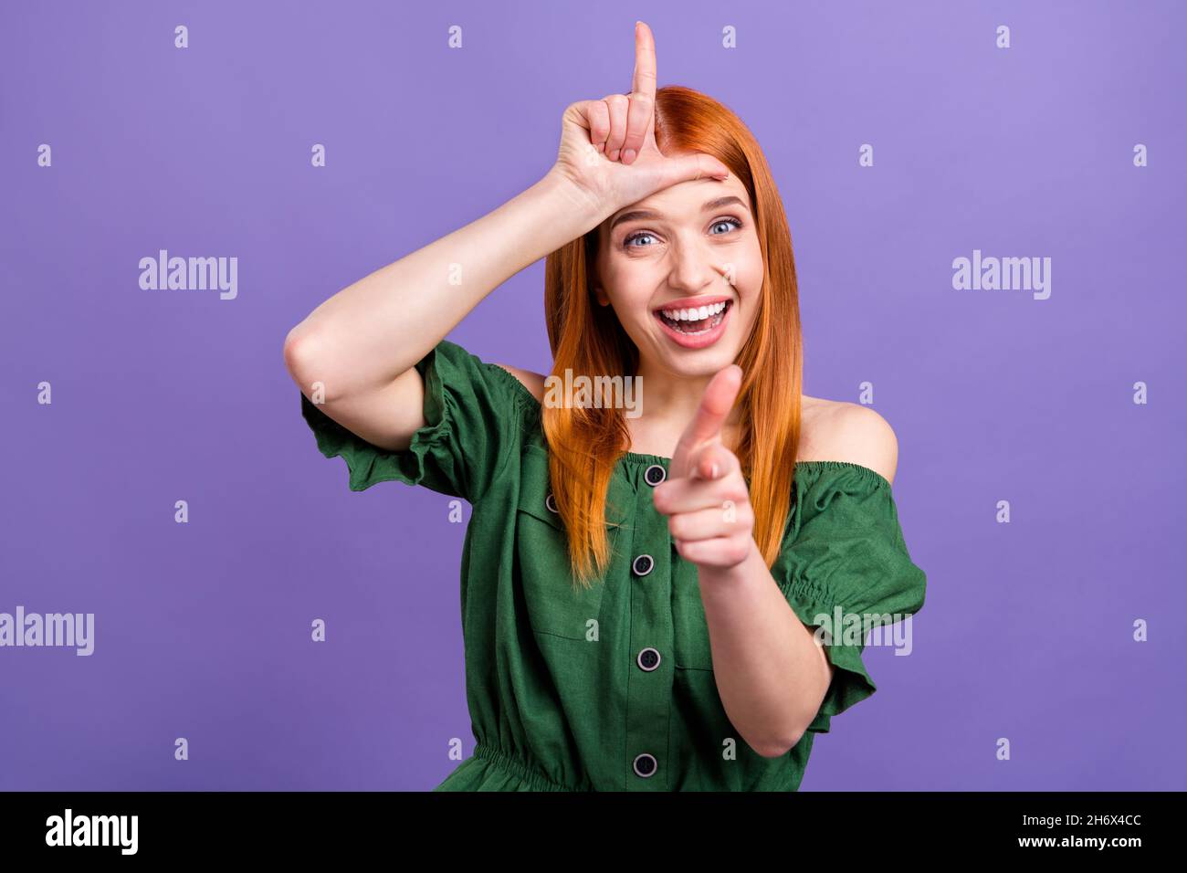 Photo of mocking childish young lady wear green blouse sowing loser ...