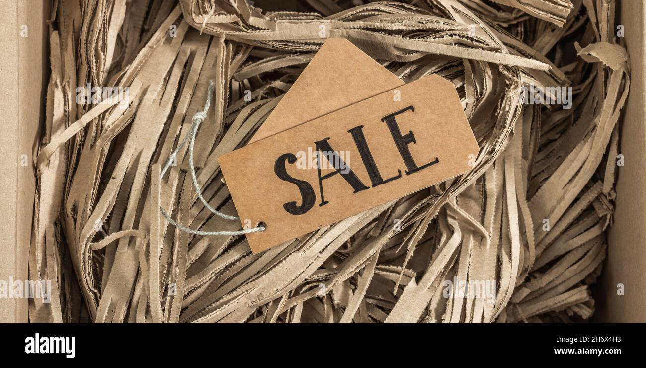 Black Friday. Sale tag on the paper filler. Zero waste shopping concept ...