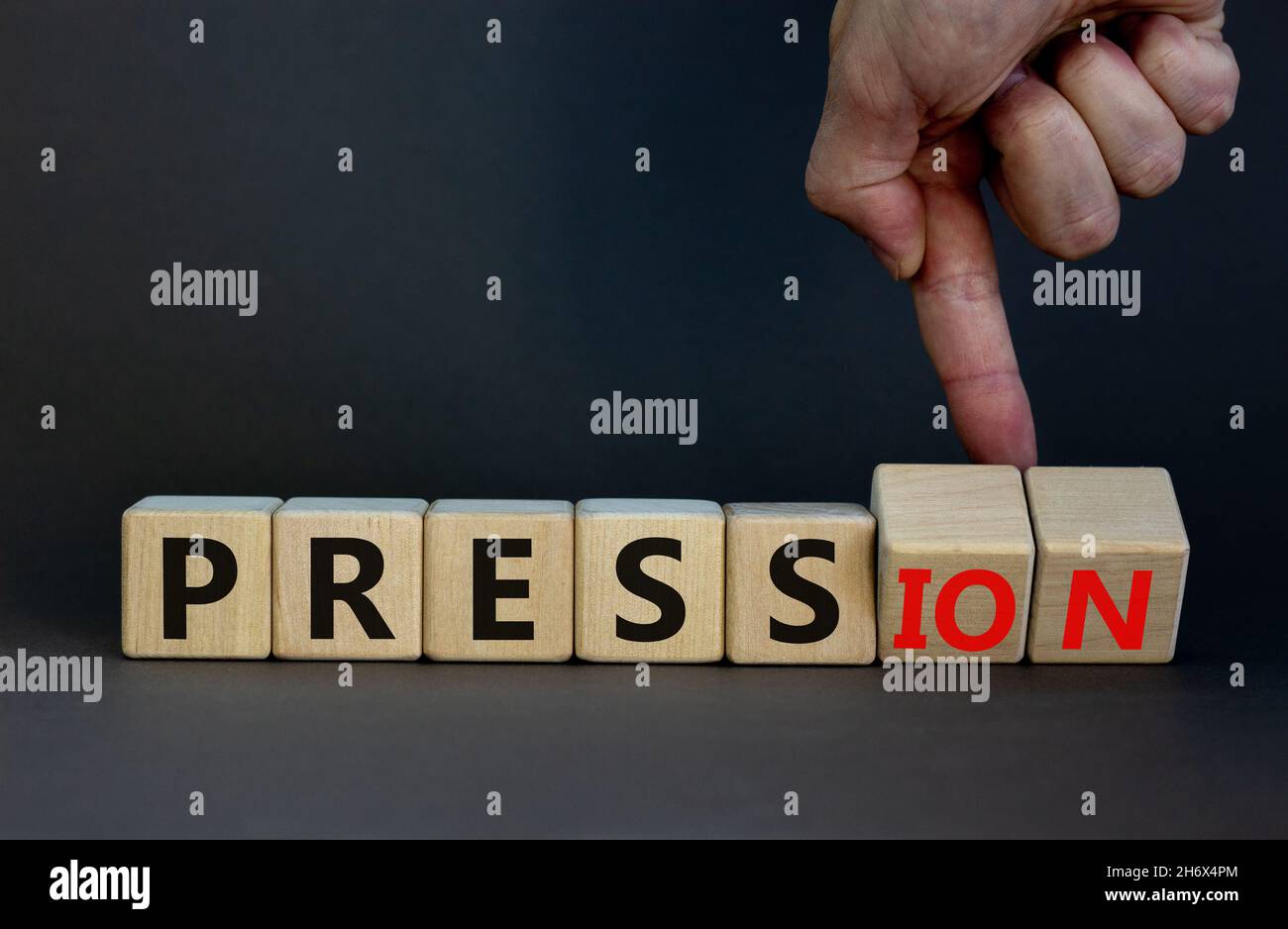 Pression to free press symbol. Businessman turns wooden cubes and ...