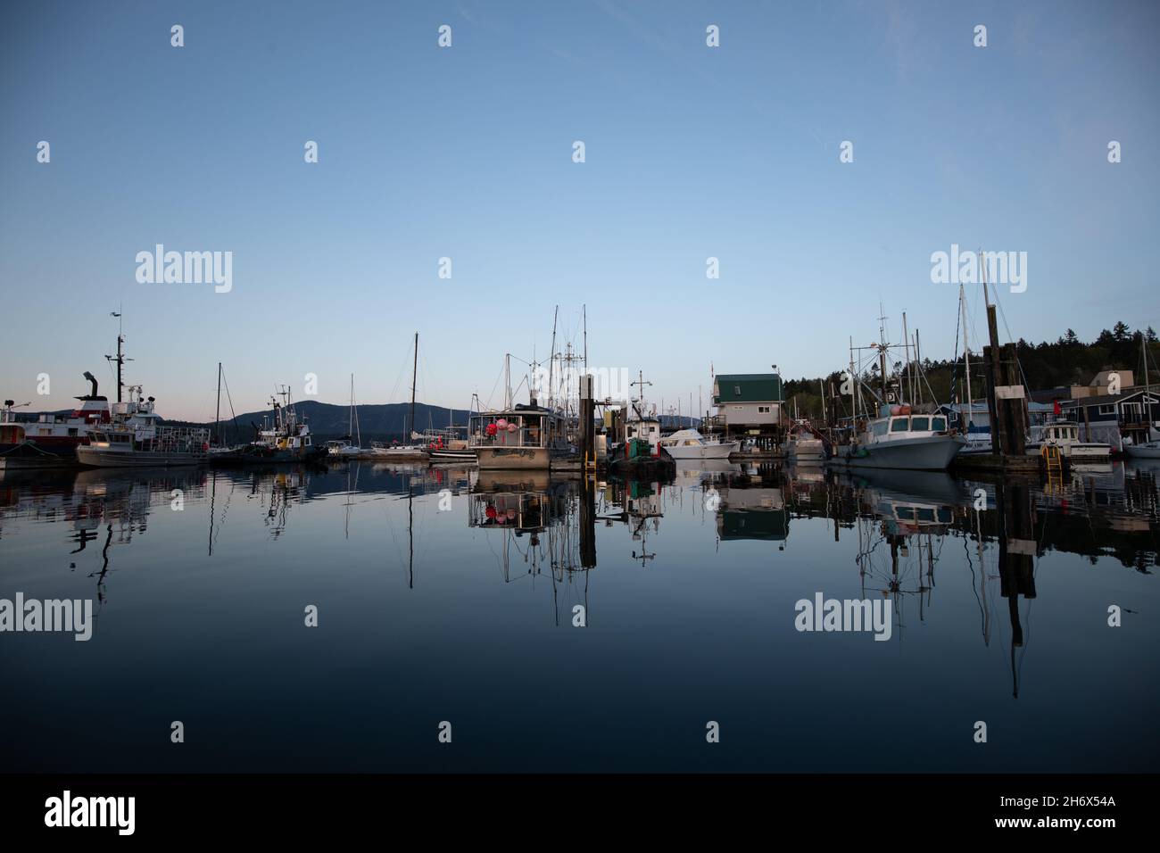 Fishing boat docked at wharf hi-res stock photography and images - Alamy