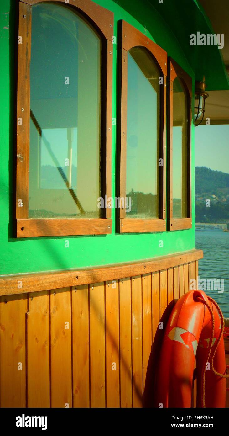 Front of a wheelhouse on a sailing ship in green and bronze Stock Photo ...