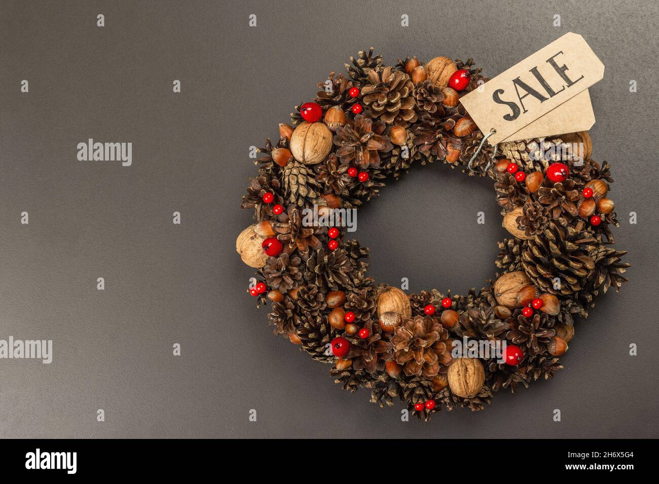 Black Friday Sale concept. Autumn wreath with handmade paper tag. Black ...