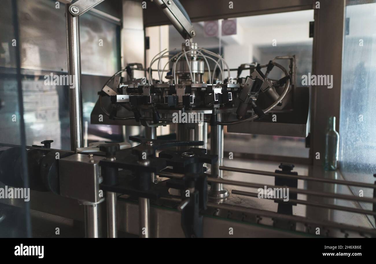 Automatic monoblock wine filling machine at wine factory Stock Photo ...