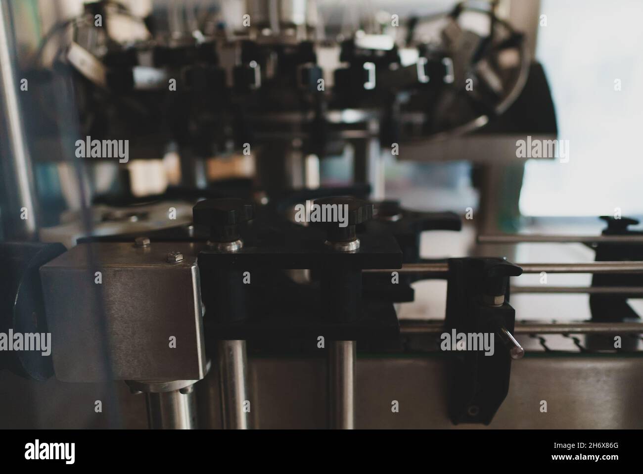 Automatic monoblock wine filling machine at wine factory Stock Photo ...