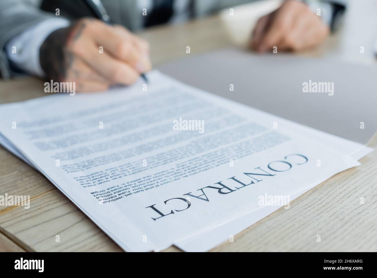 Asian man signing contract hi-res stock photography and images - Alamy