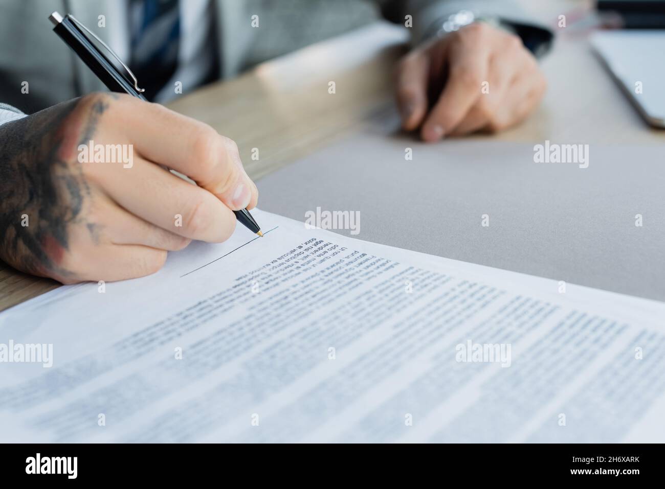 Asian man signing contract hi-res stock photography and images - Alamy