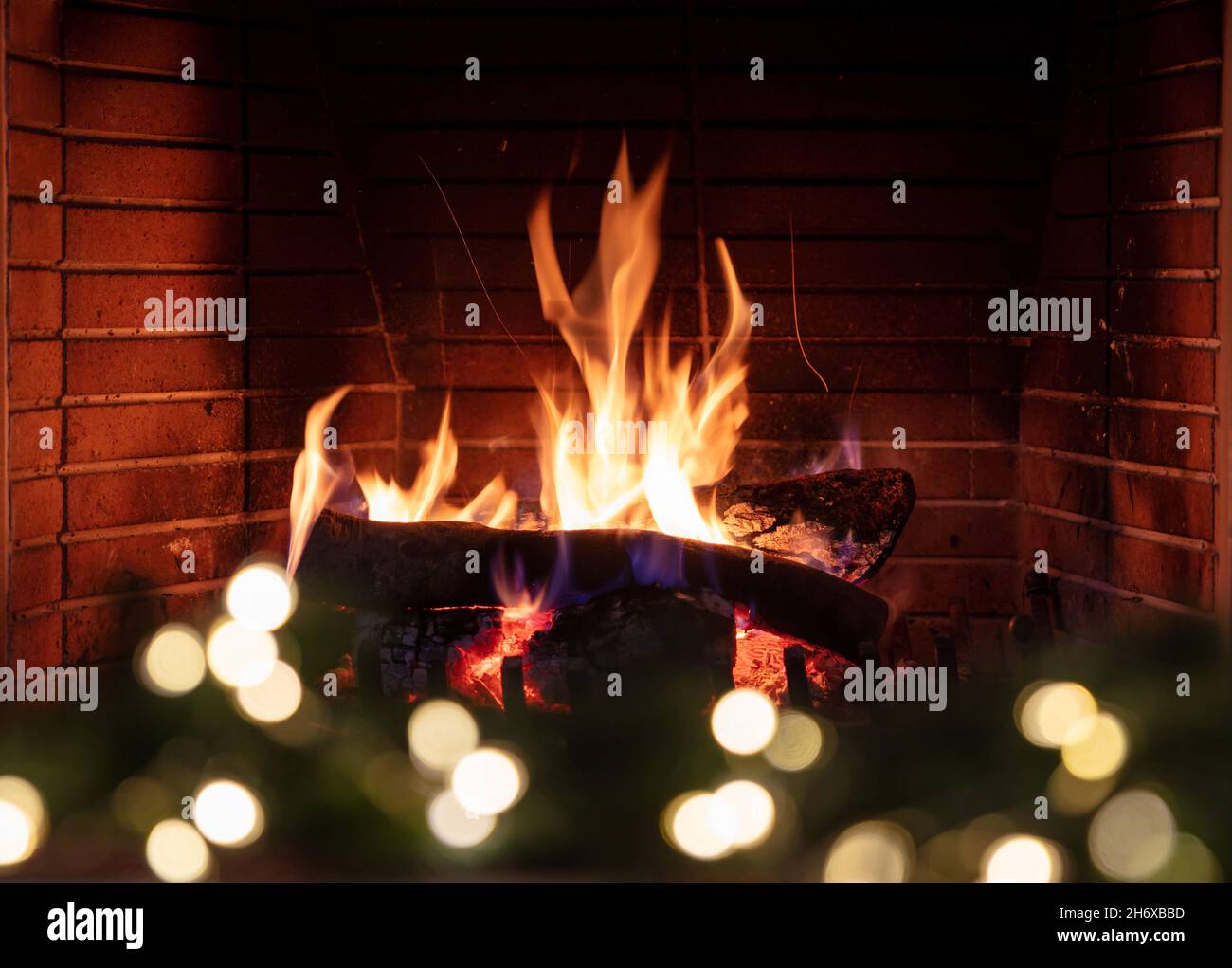 Christmas lights and burning fireplace, bonfire fire flames and festive ...