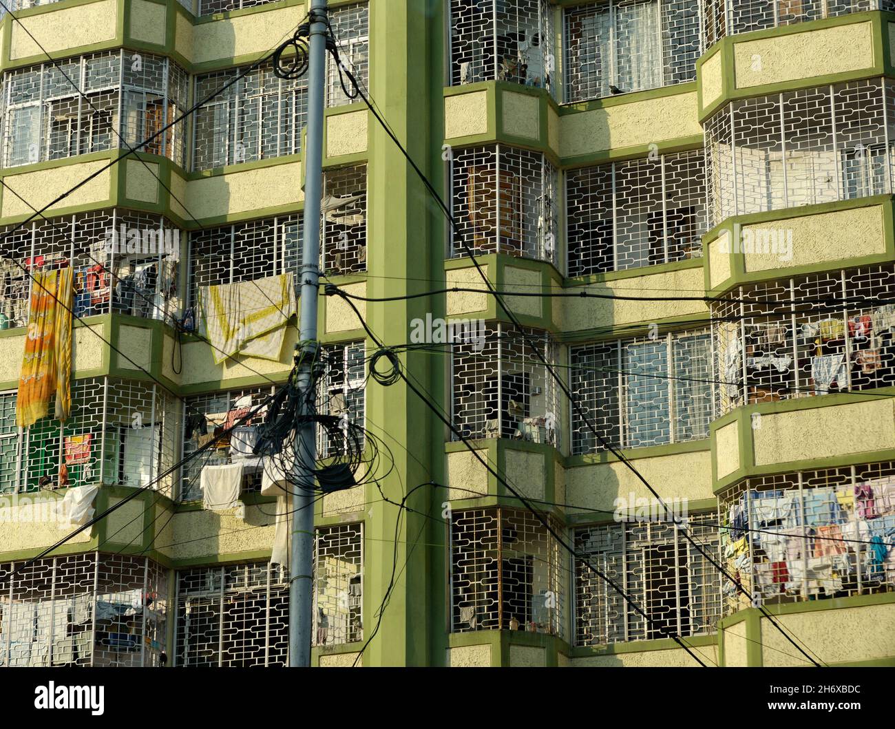 Tight crop of a housing block of flats with washing hanging from ...