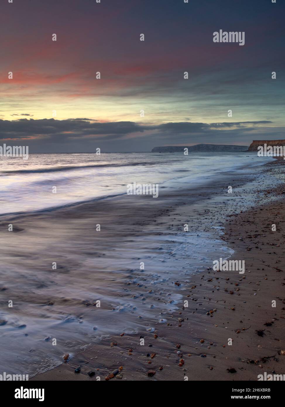 sunset over compton bay on the coastline or shoreline of the isle of ...