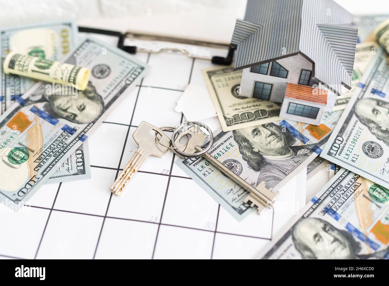 house layout and dollar bills on the background Stock Photo - Alamy