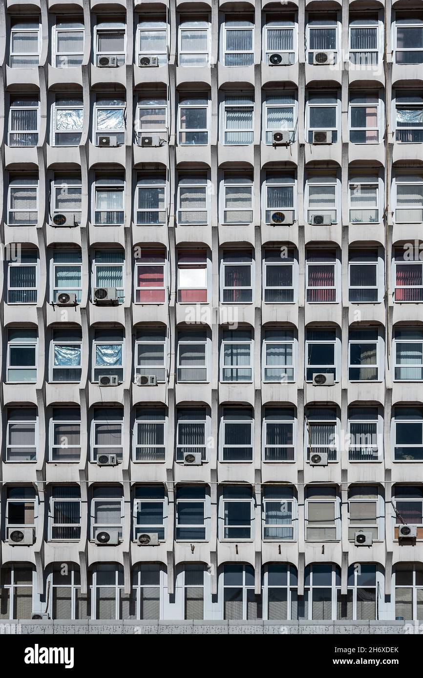 Soviet architecture. Facade of gray building with windows background ...