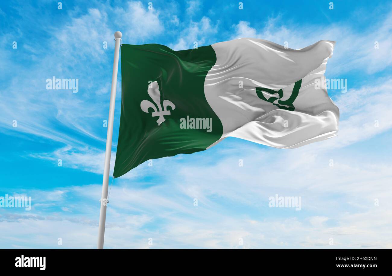 flag of Franco Ontarian, France at cloudy sky background on sunset ...