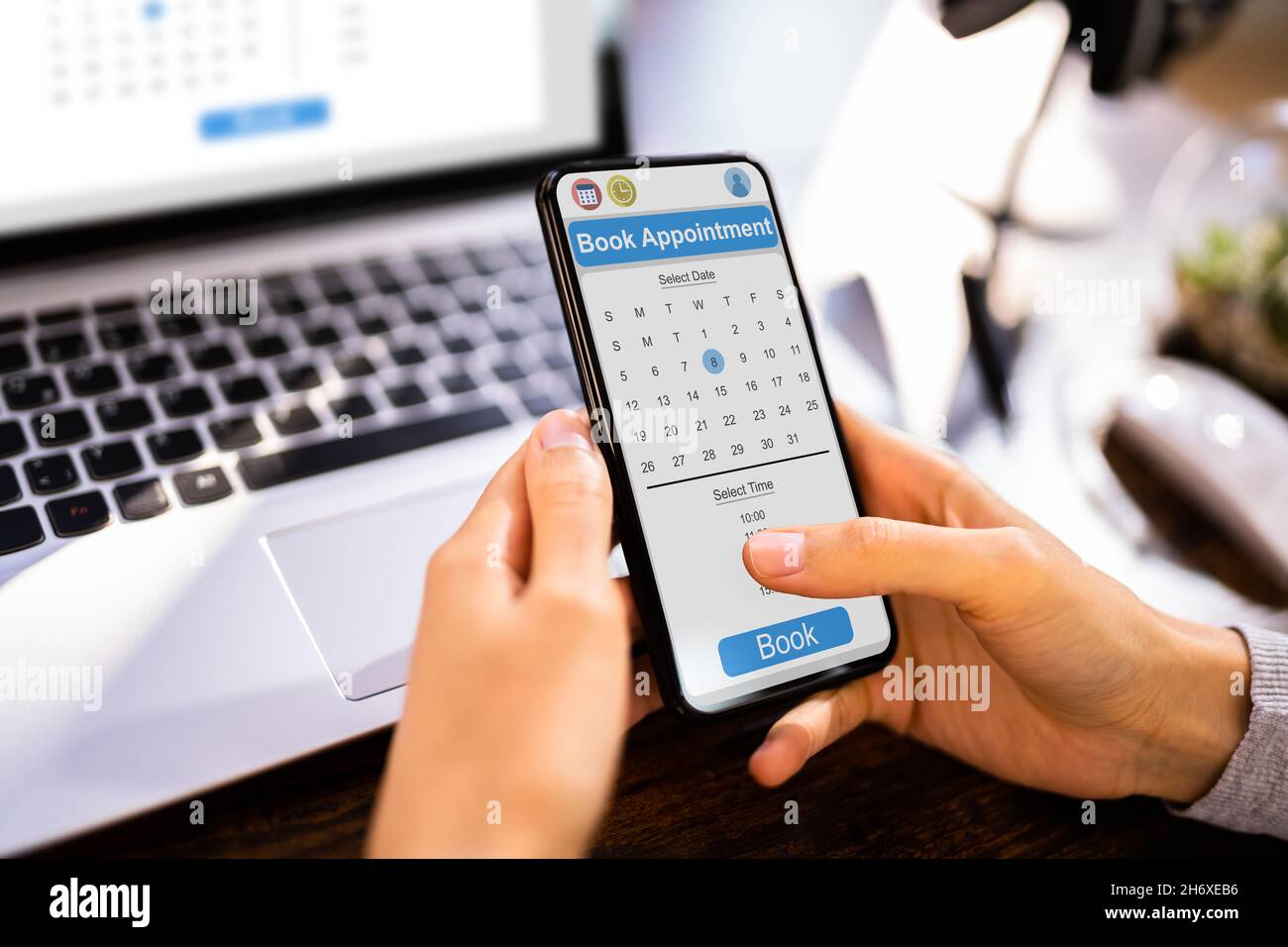 Woman Looking At Month Agenda In Calendar On Smart Phone Stock Photo ...