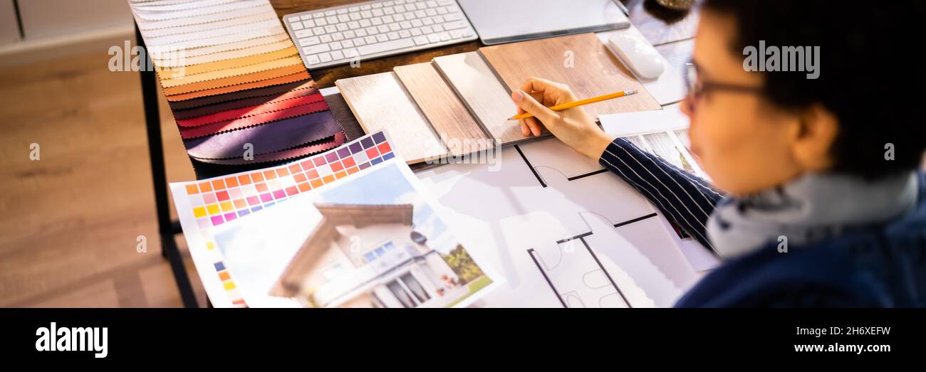 Side View Of Real Estate Designer Working On Computer In Office Stock ...