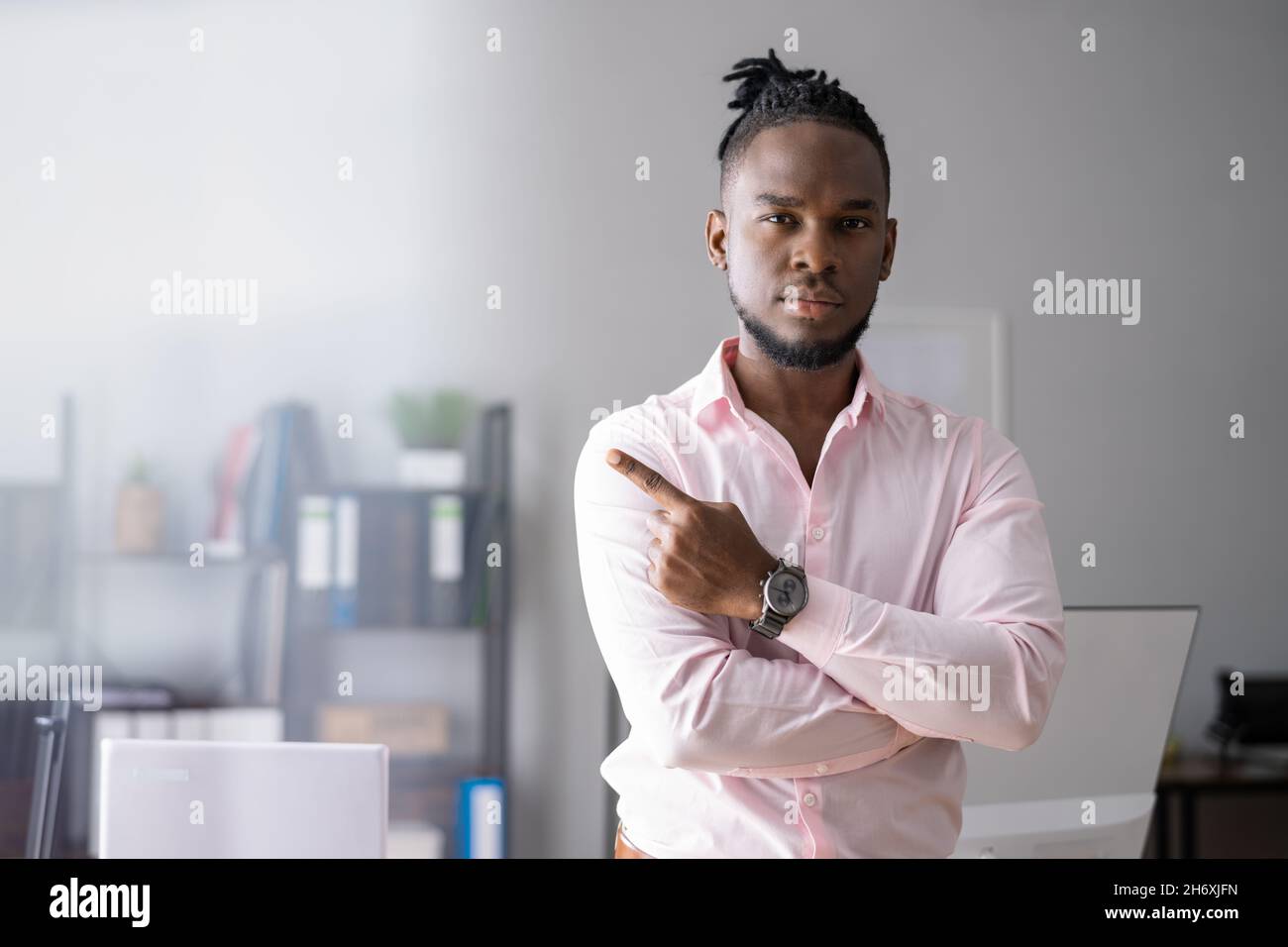 African American Man Pointing Hand Sign In Office Stock Photo - Alamy
