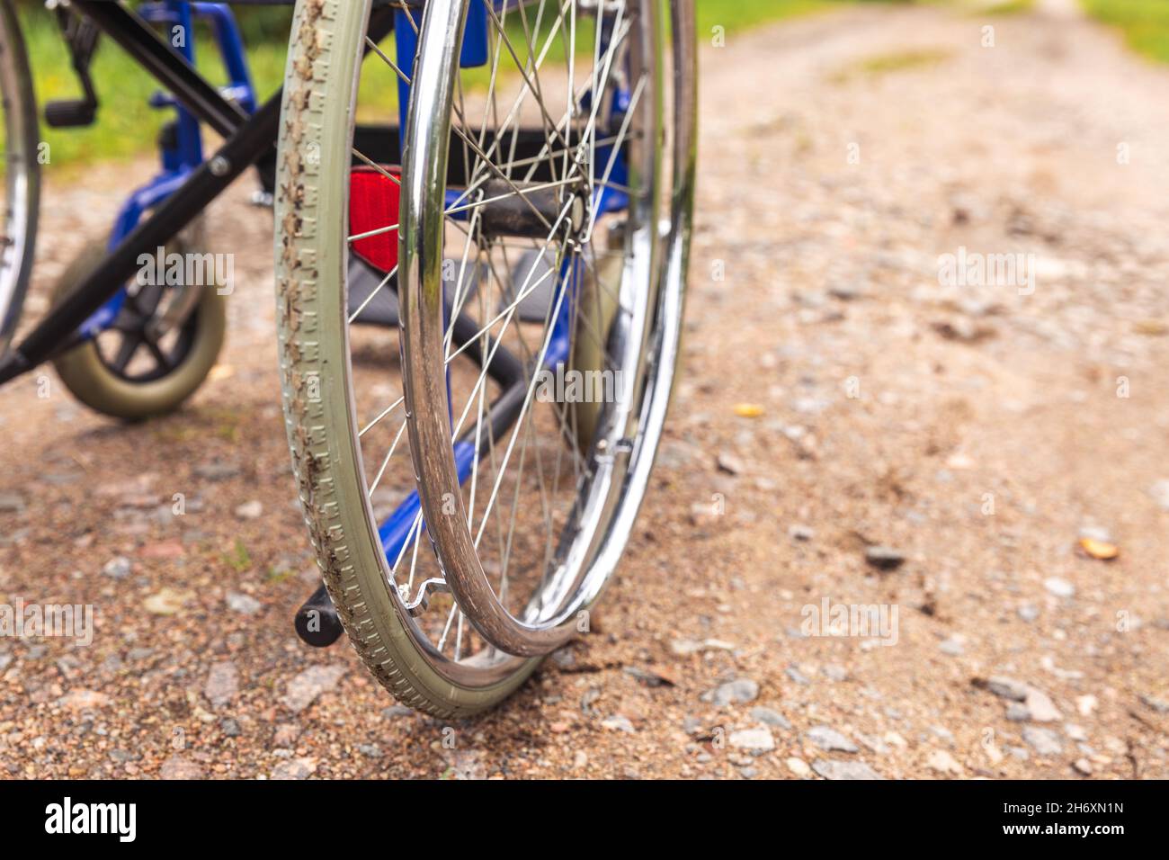 Empty wheelchair standing on road waiting for patient services. Wheel ...