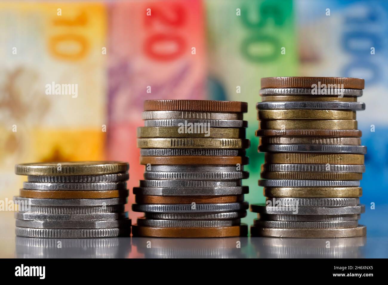 Here are stacked various coins and are shown against various ...
