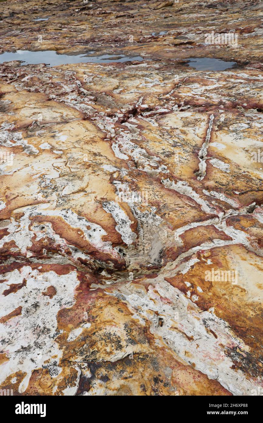 Red-coloured rocky coast at Sunset Park in Nightcliff, Darwin, Northern ...