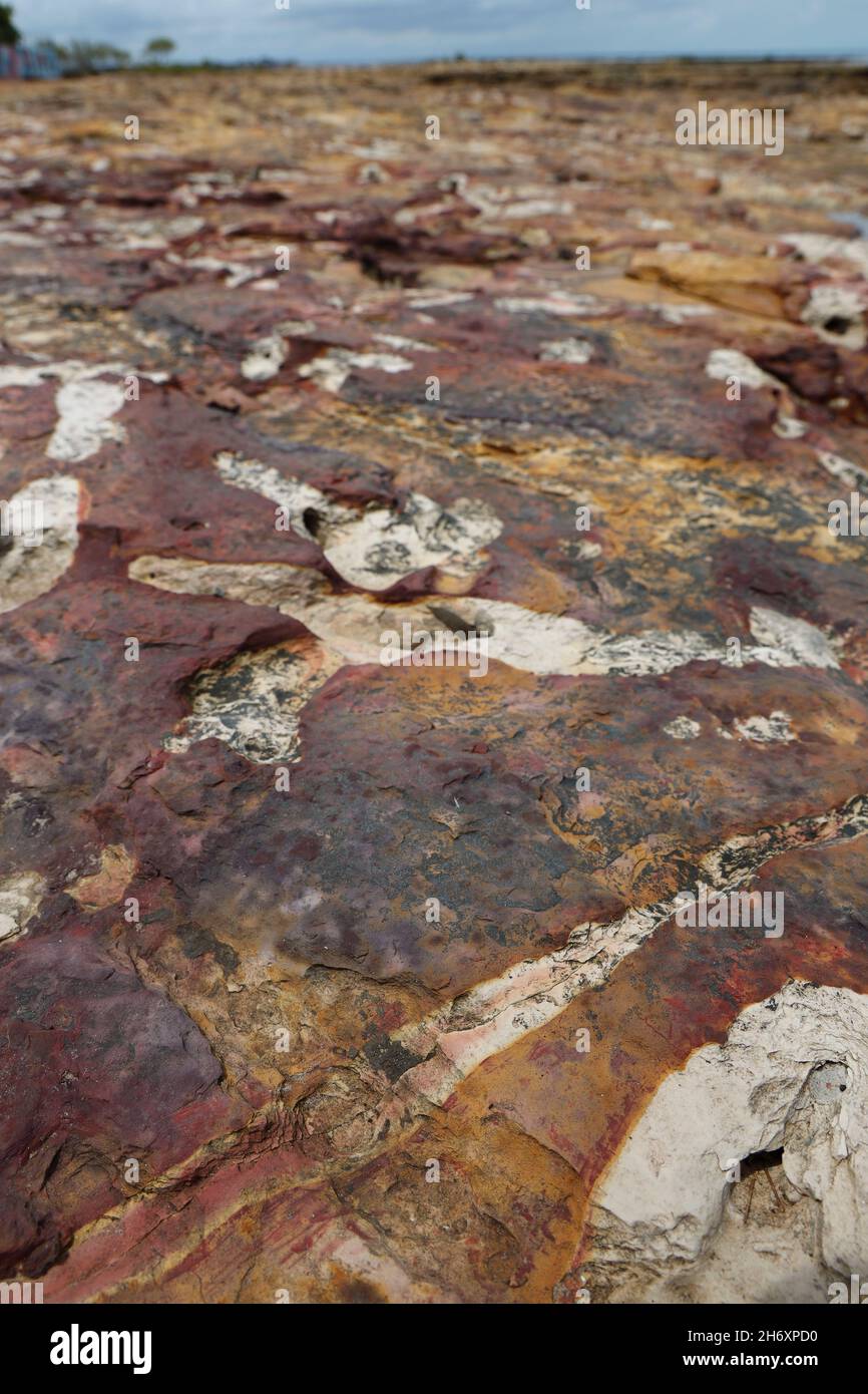 Red-coloured rocky coast at Sunset Park in Nightcliff, Darwin, Northern ...