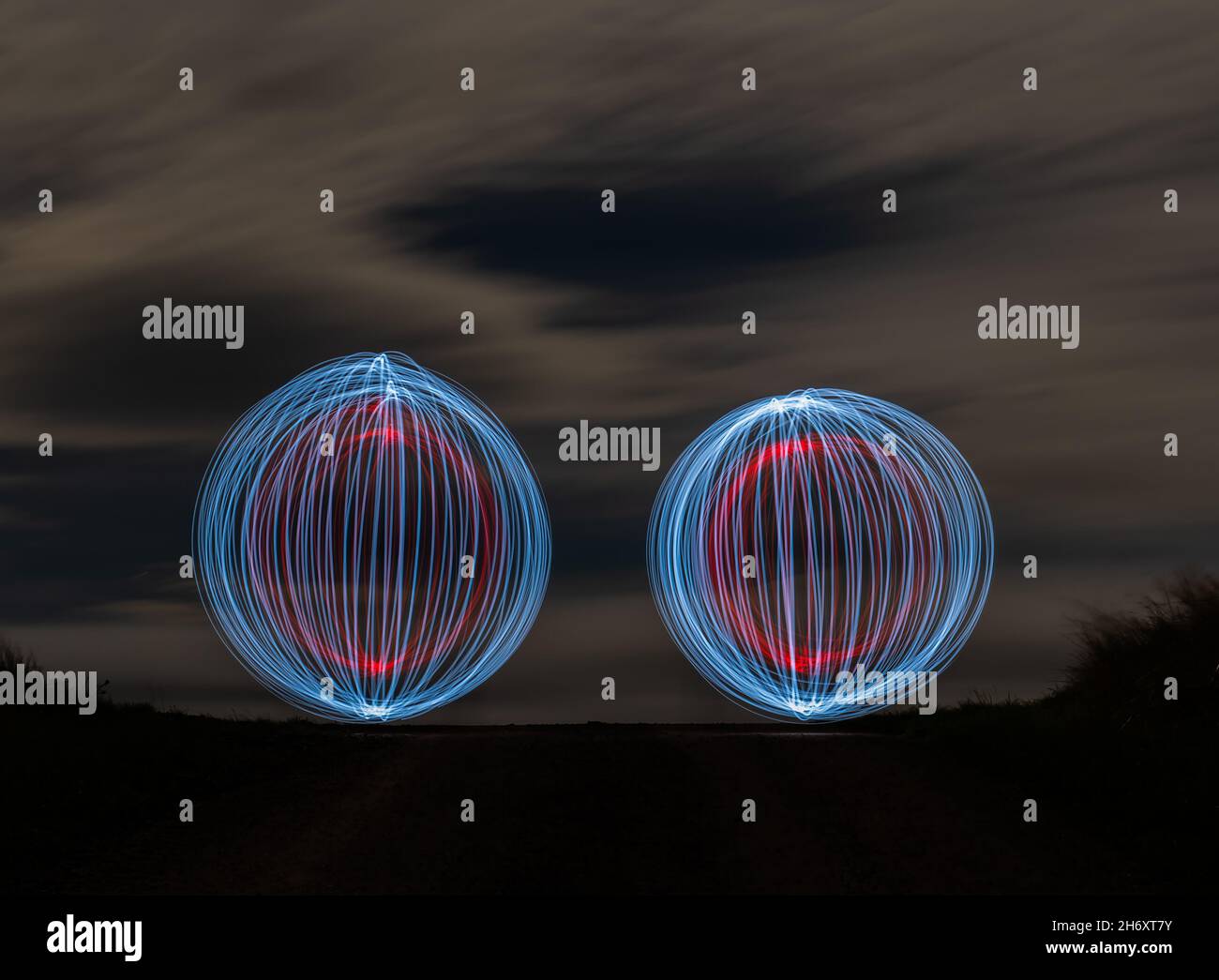 Light painting creating a circular pattern at night time with the night ...