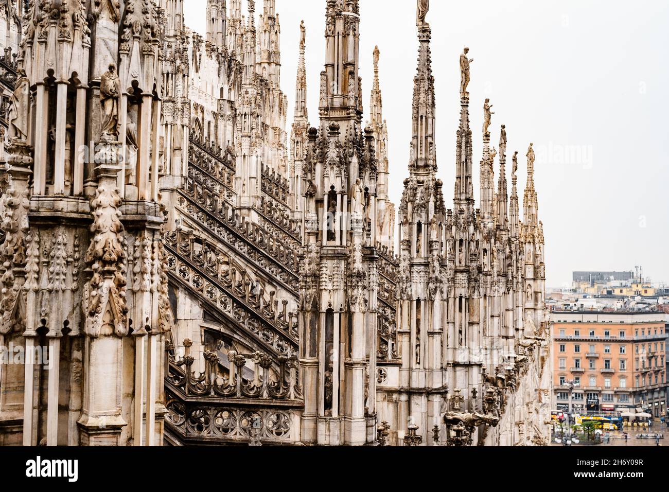 High spires with sculptures on top in the Duomo. Milan, Italy Stock ...