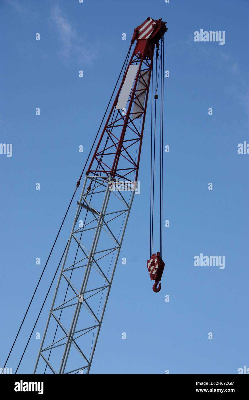 A Large Jib Crane on a Blue Sky Background Stock Photo - Alamy