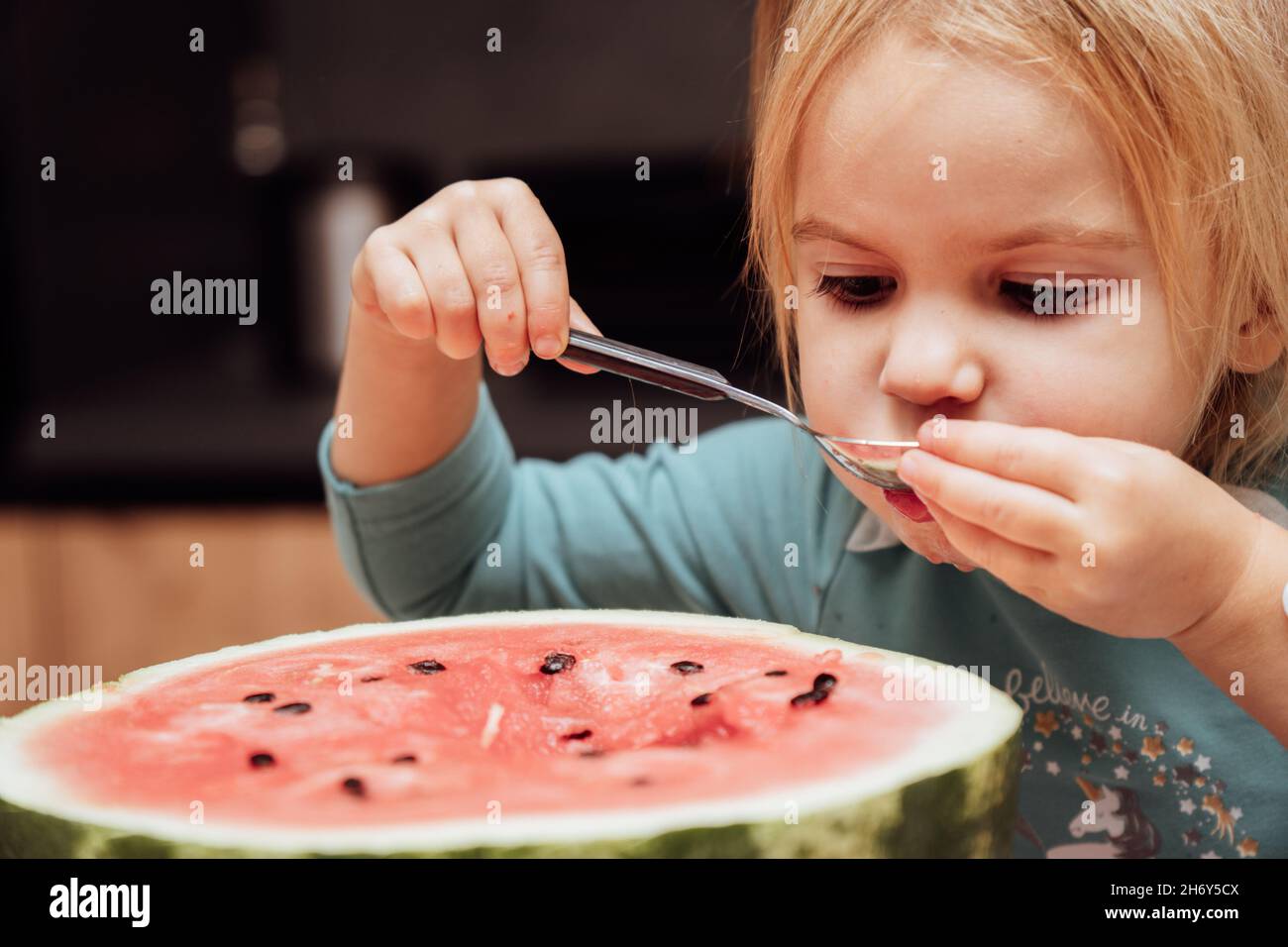 Kid eating watermelon Stock Photo - Alamy