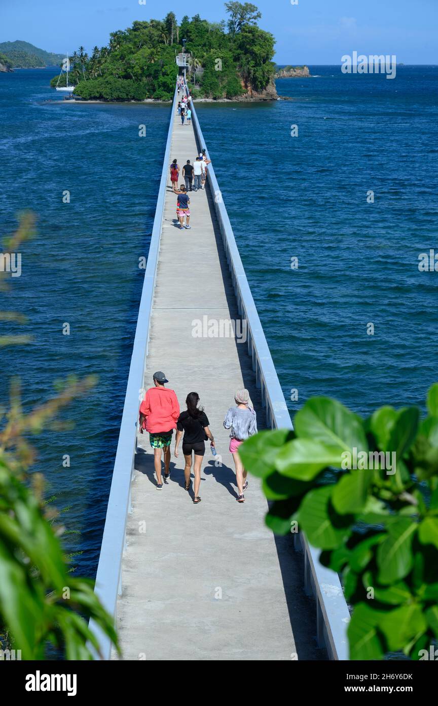 HD photo shows a bridge between islands in the Caribbean. Samana city ...