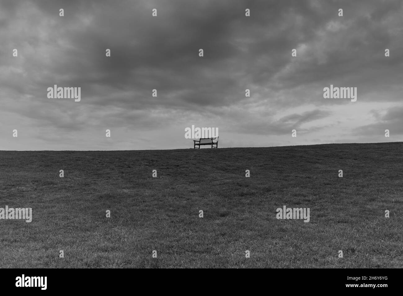 The lone bench on The Downs in Swanage Bay, Dorset, UK Stock Photo - Alamy