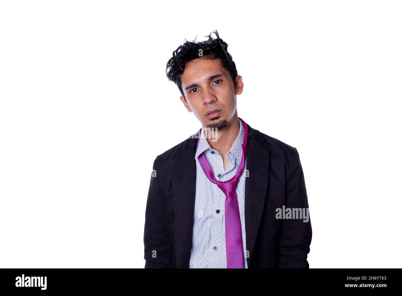 Bewildered businessman, staring at the camera with stunned expression ...