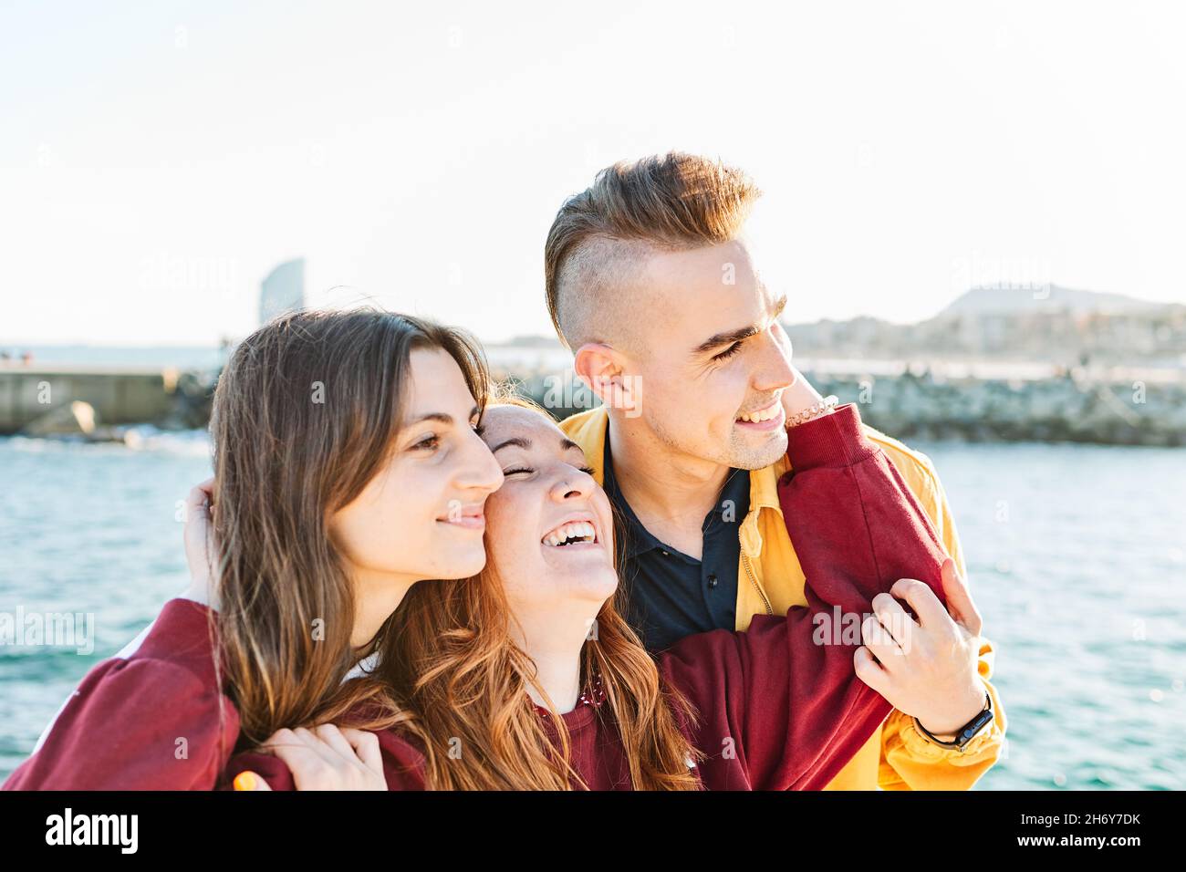 Friends standing together and hugging hi-res stock photography and ...